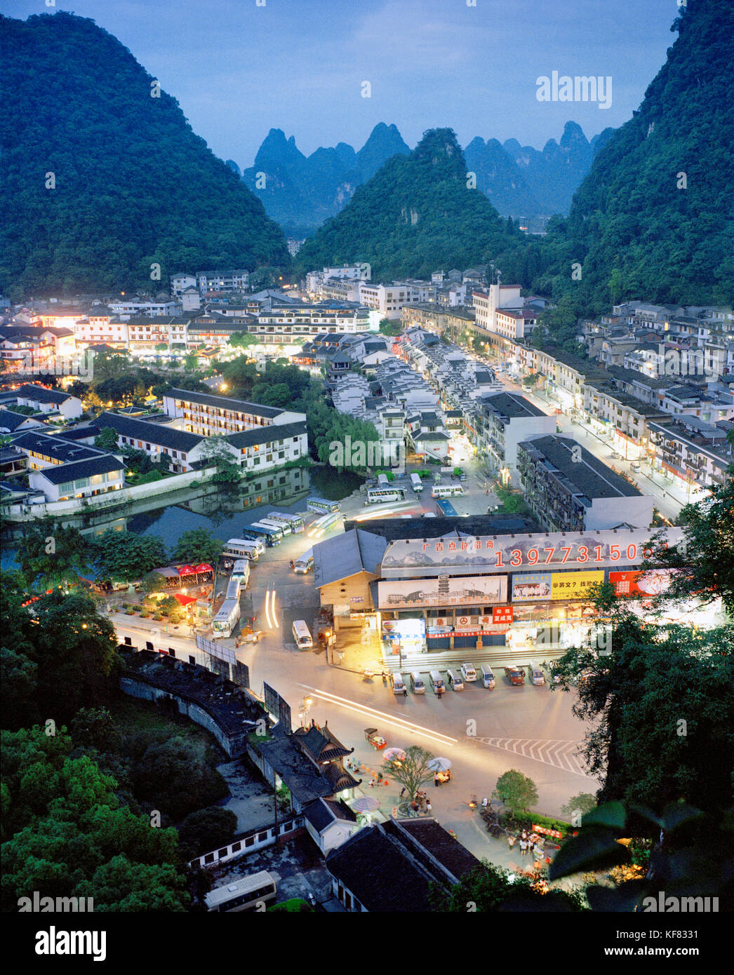 CHINA, Guilin, elevated view of Guilin and limestone spires at dusk ...