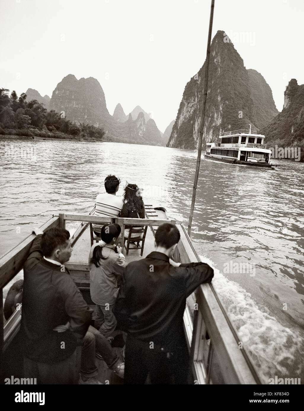 CHINA, Guilin, people travel on a boat down the Li River (B&W Stock ...
