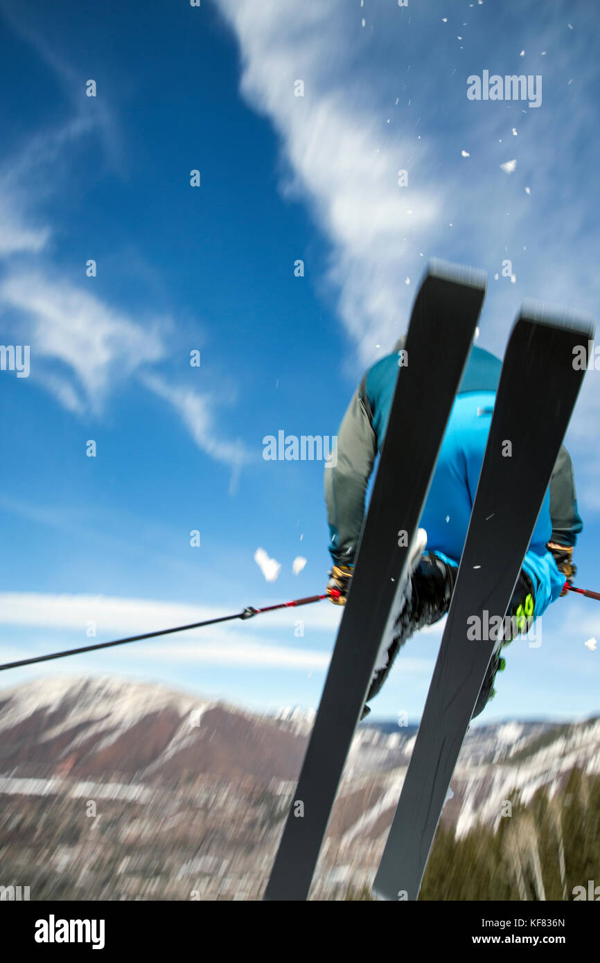 USA, Colorado, Aspen, skier getting air on a trail called Corkscrew ...