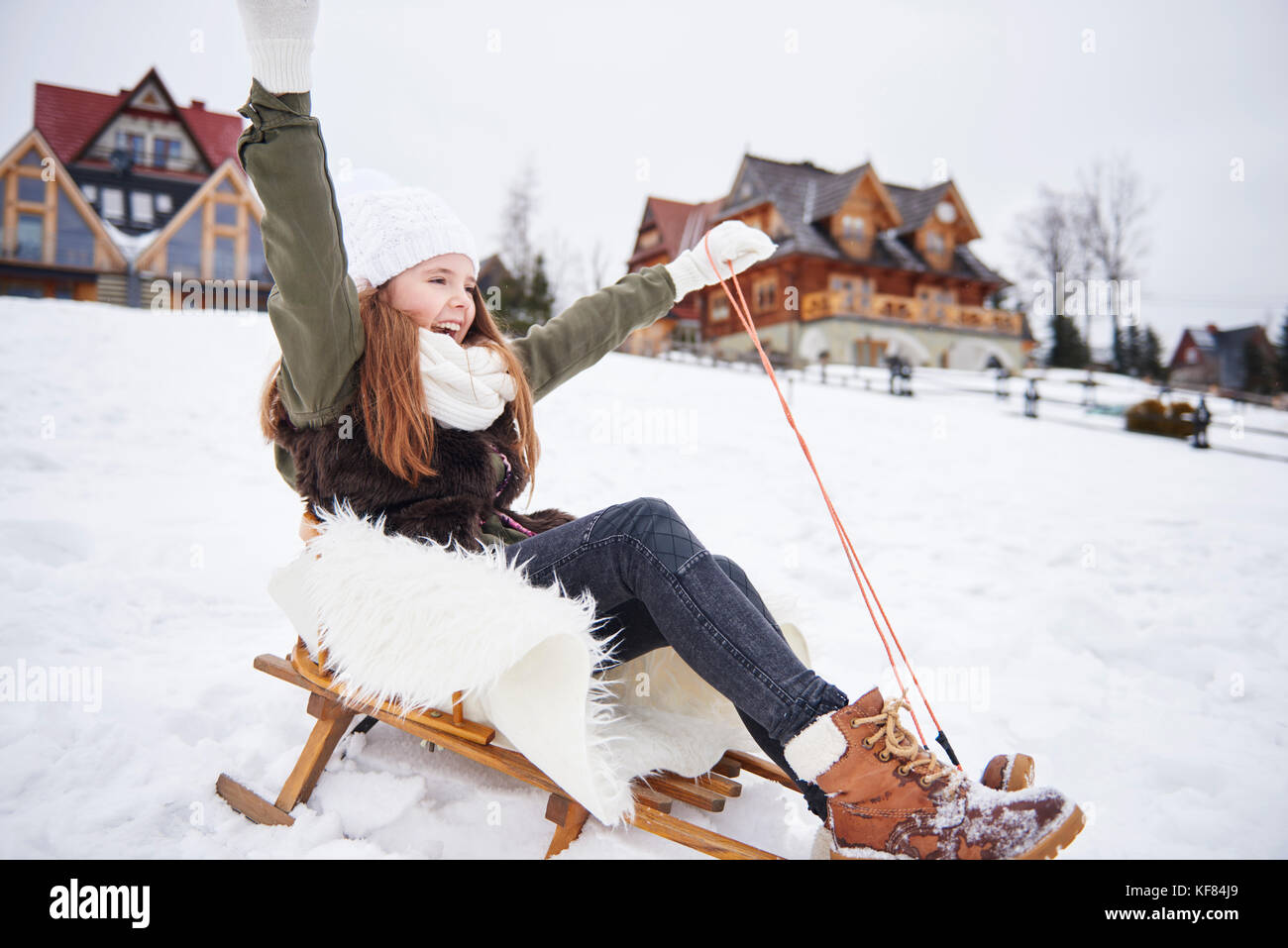 Girl with toboggan hi-res stock photography and images - Alamy