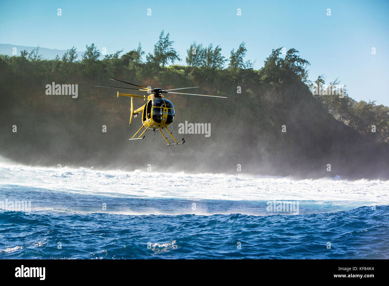 USA, HAWAII, Maui, Jaws, a helicopter hovering over the big waves and ...