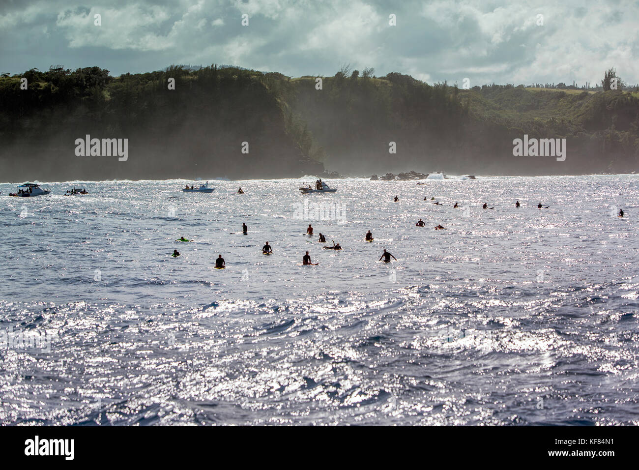 USA, HAWAII, Maui, Jaws, surfers and boats in the water at Peahi on the ...