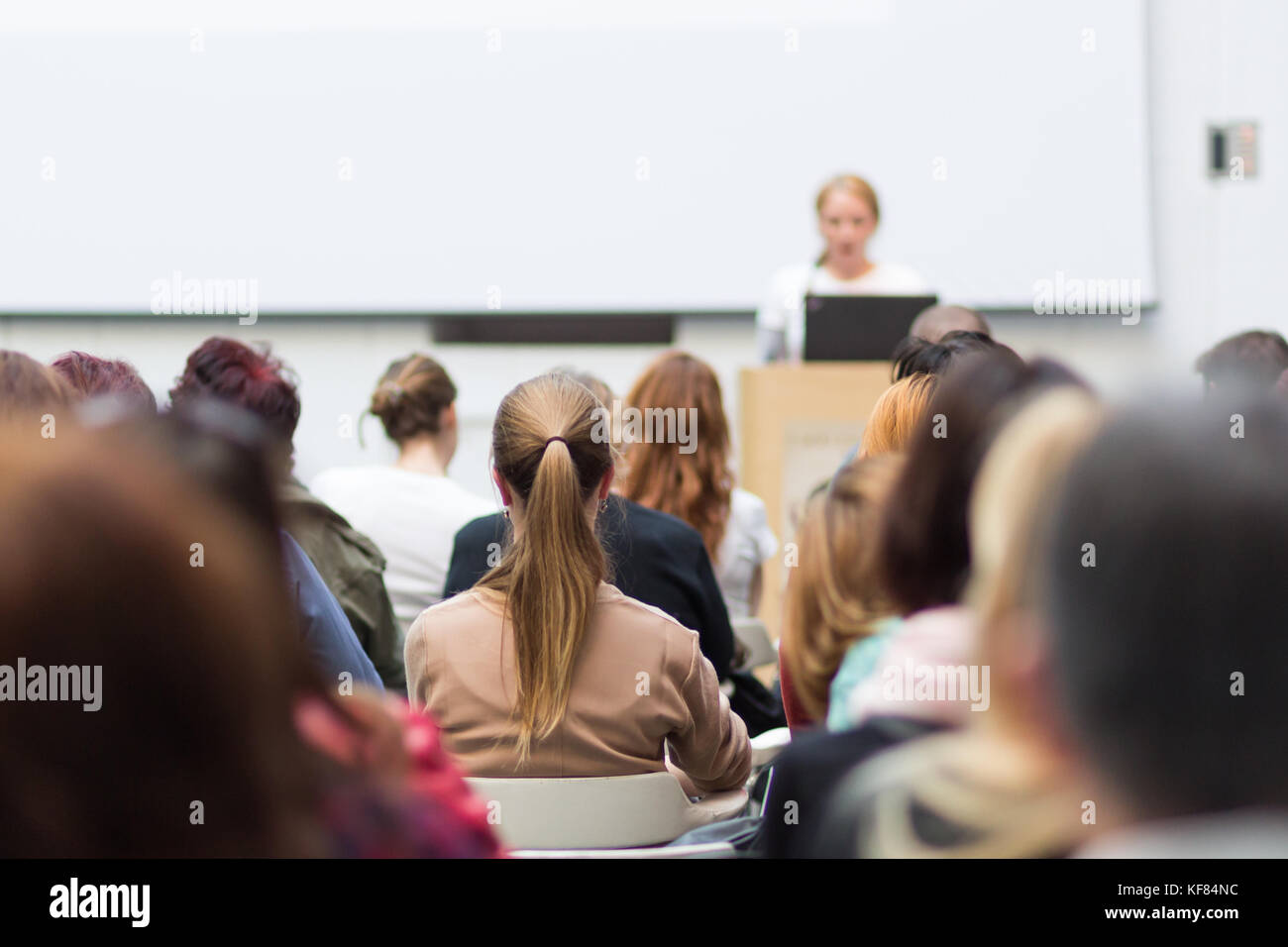 Woman giving presentation on business conference Stock Photo - Alamy