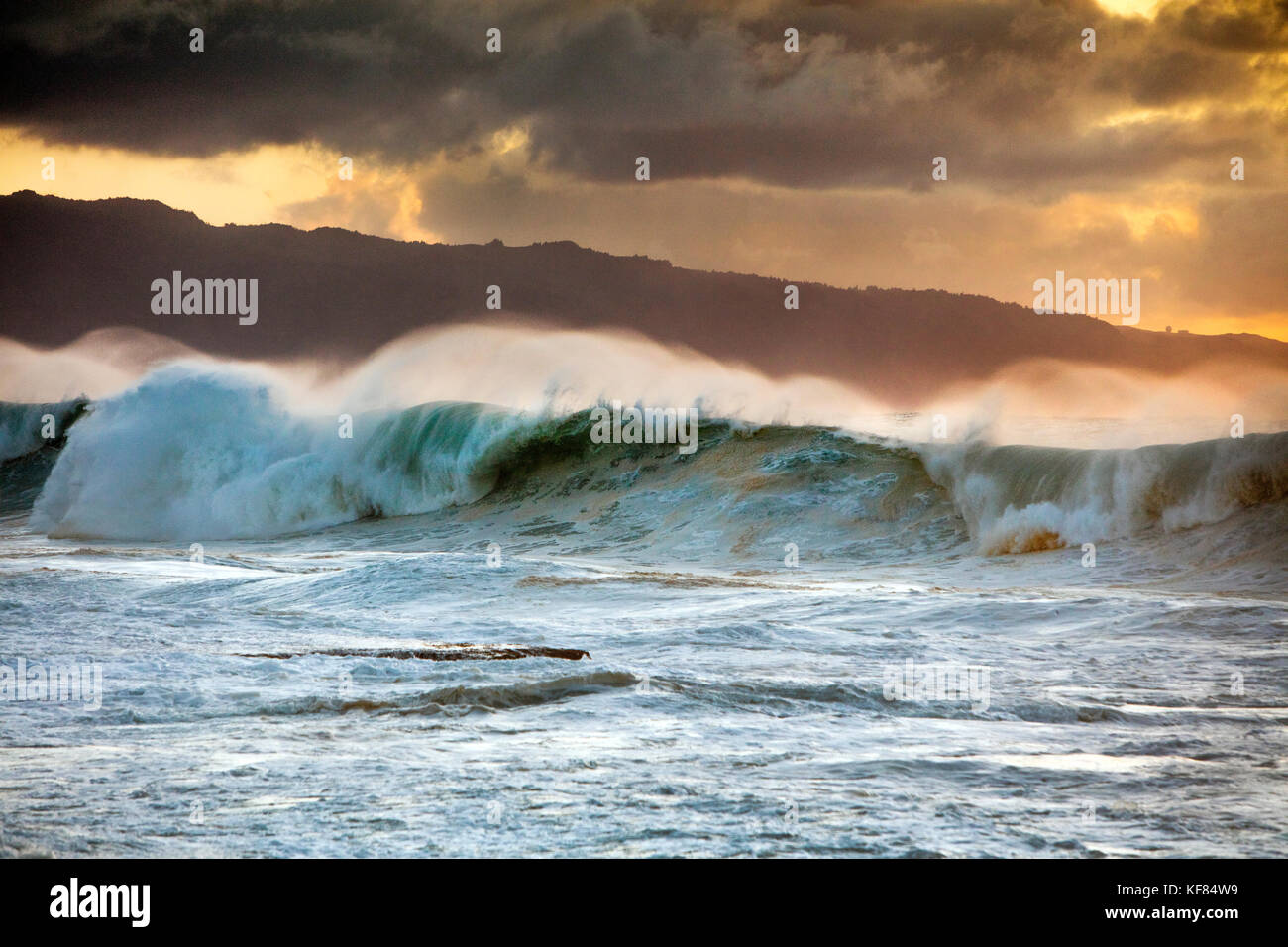 HAWAII, Oahu, North Shore, Big Swell rolling in at sunset at Pupukea ...