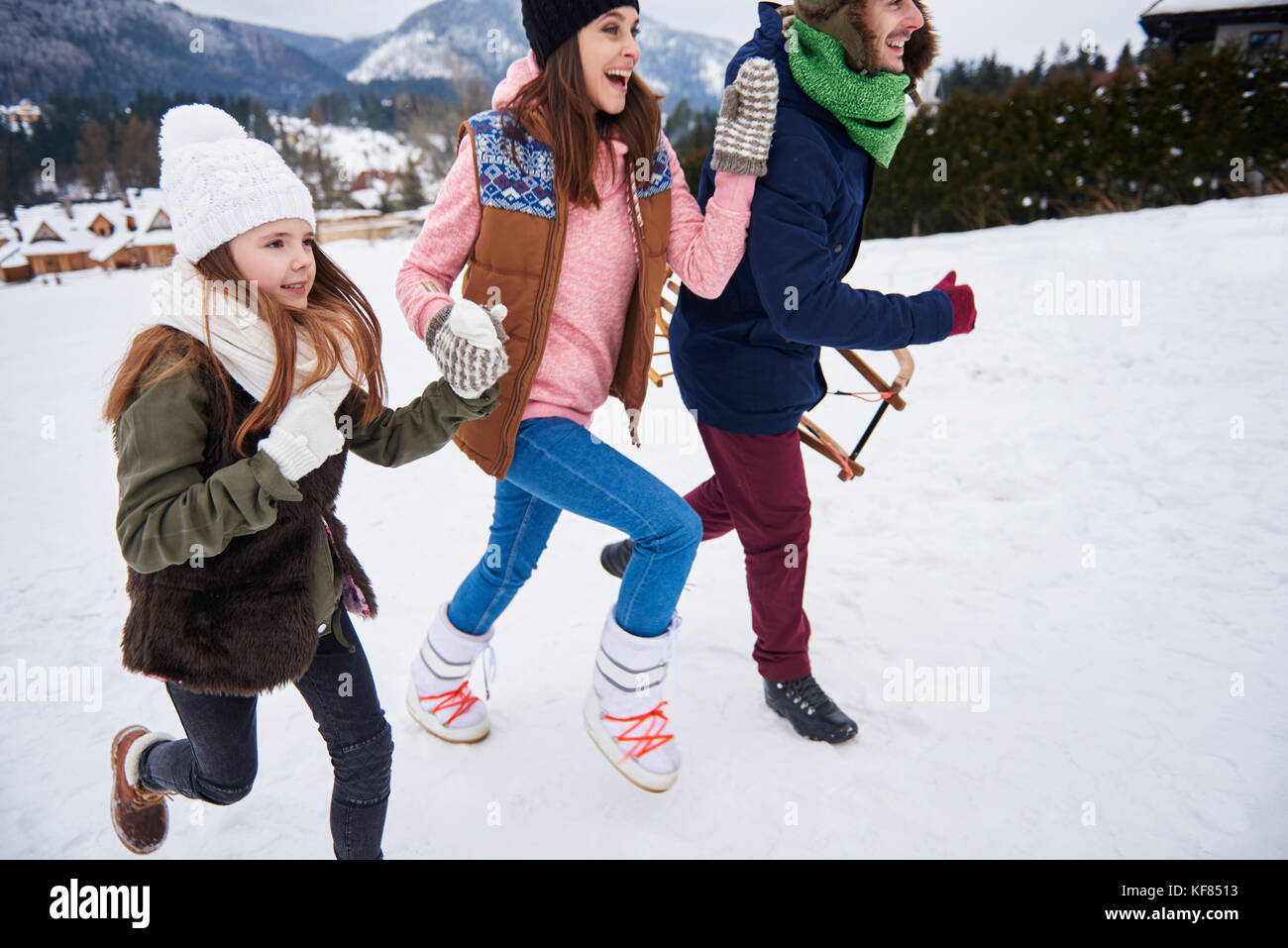 Close up of running parents with kid Stock Photo - Alamy