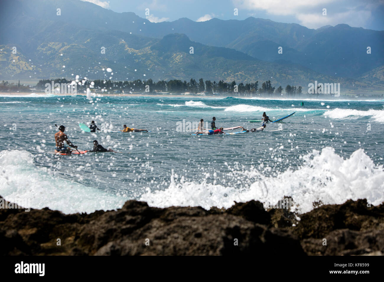HAWAII, Oahu, North Shore, individuals surfing at Puaena Point Beach ...