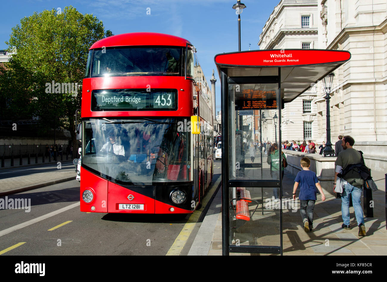 London, England, UK. Double decker red London bus at a bus stop in ...