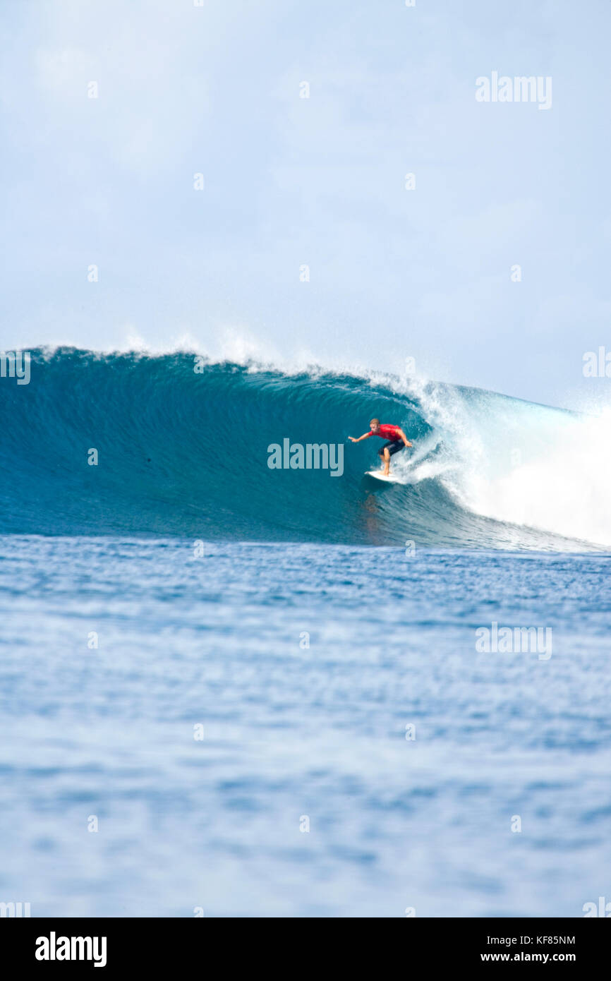 INDONESIA, Mentawai Islands, Kandui Resort, surfer on a wave at ...