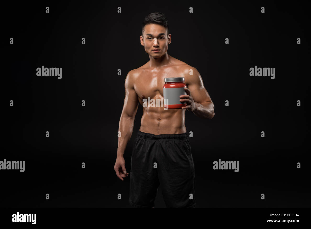 muscular man with sport nutrition Stock Photo - Alamy