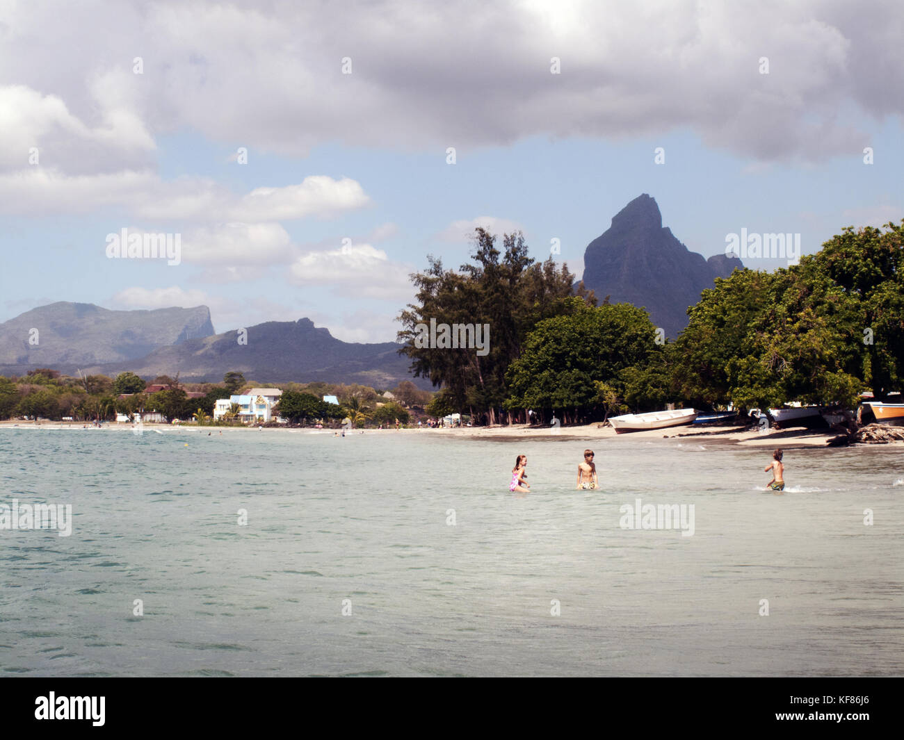 MAURITIUS, Tamarin, kids play in the water of Tamarin Bay, Indian Ocean ...