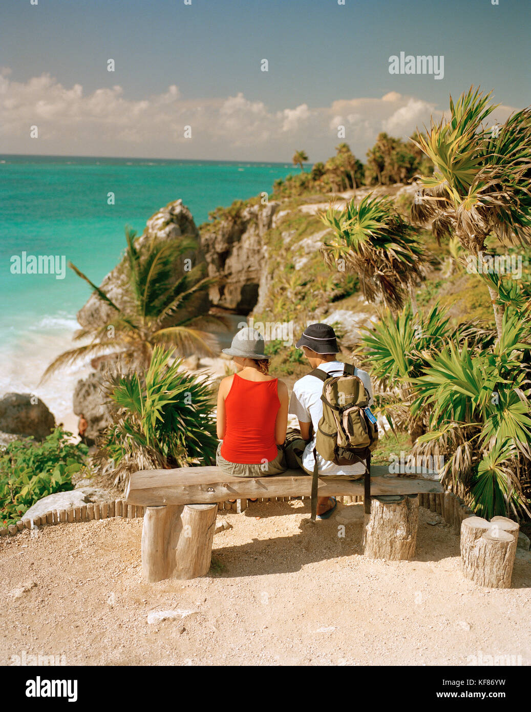 MEXICO, Maya Riviera, couple sitting on bench at the Tulum Ruins Stock ...