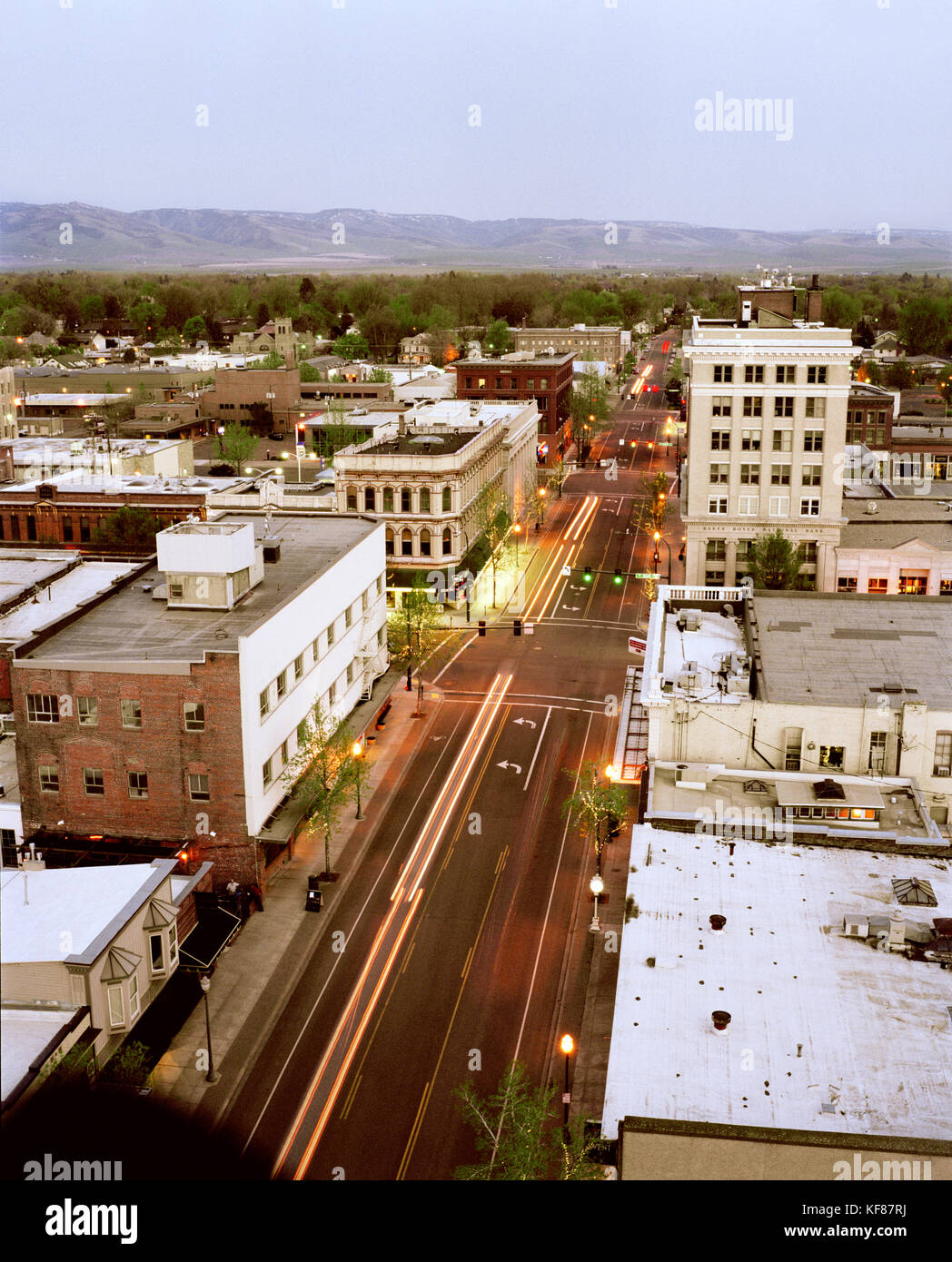 USA, Washington State, Walla Walla cityscape at dusk with mountains in ...