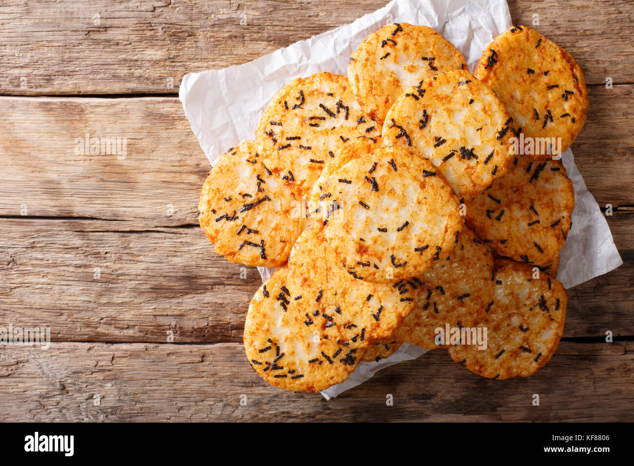 Japanese snack rice cake with seaweed and tapioca close-up on the table ...