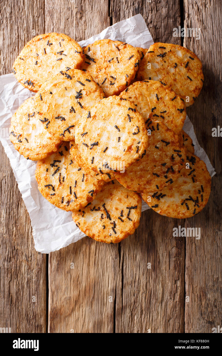 Japanese snack rice cake with seaweed and tapioca close-up on the table ...