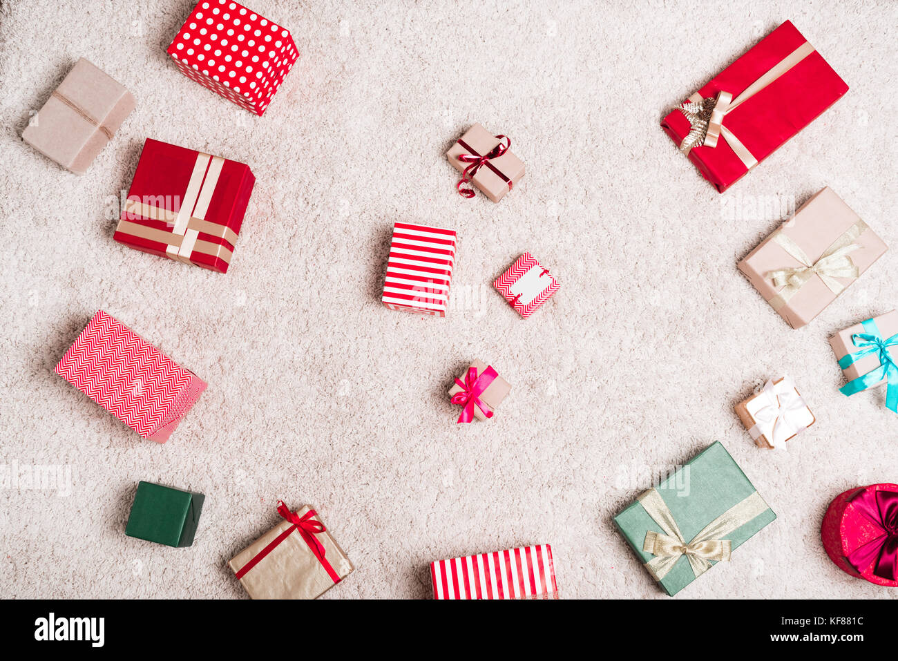 christmas gifts on floor Stock Photo - Alamy