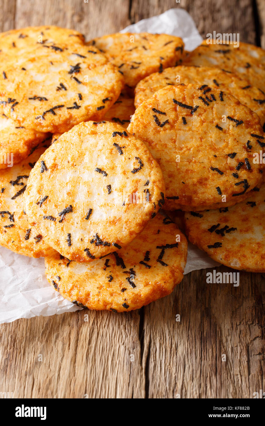 Japanese food: pepper rice crackers with seaweed and tapioca close-up ...