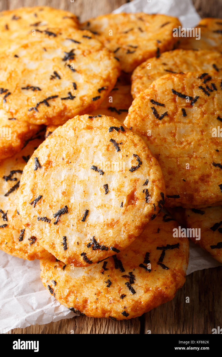 Delicious snack rice crackers with seaweed and tapioca close-up on the ...