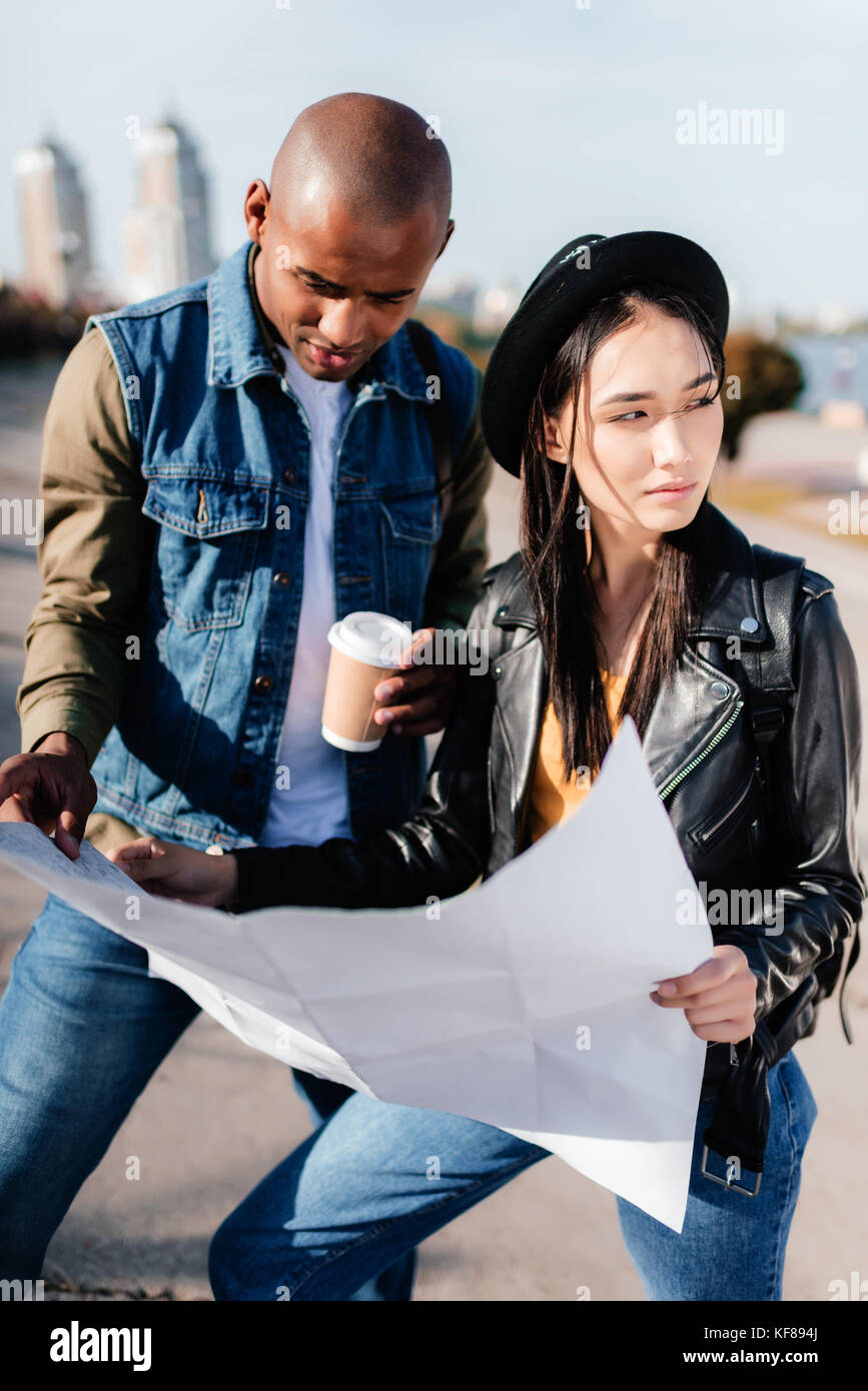 multicultural couple with map Stock Photo - Alamy