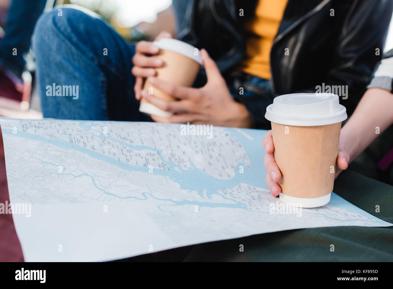 women with map and coffee to go Stock Photo - Alamy