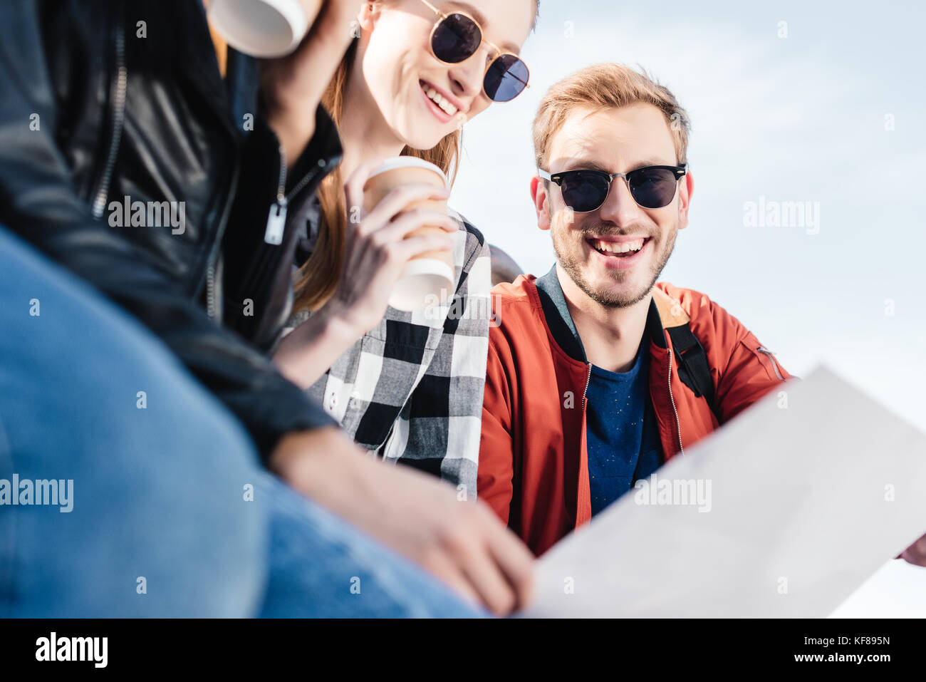 smiling friends in sunglasses Stock Photo - Alamy