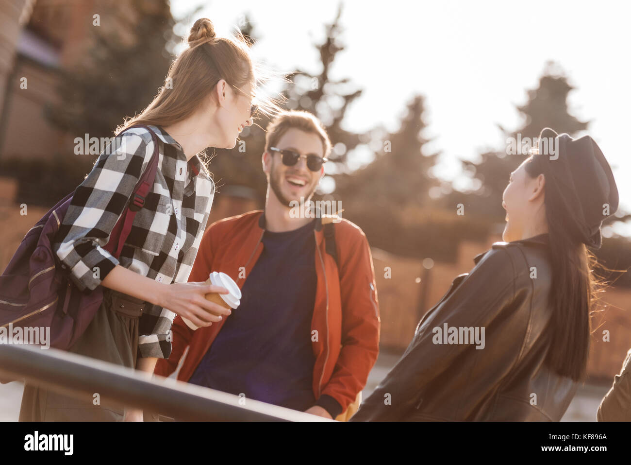 smiling friends on street Stock Photo - Alamy