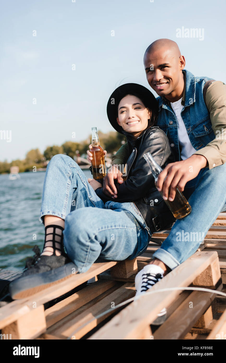 multicultural couple with drinks Stock Photo - Alamy
