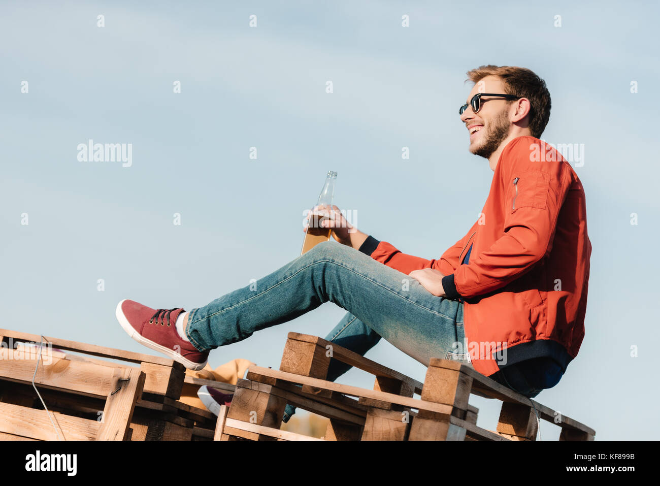 smiling man with drink Stock Photo - Alamy