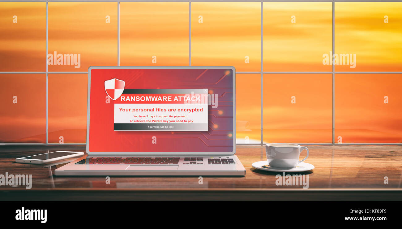 Laptop with cyber ransomware screen and silver color placed on a wooden ...