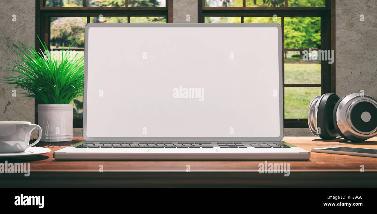 Laptop with silver color and white screen placed on a wooden desk, Room ...