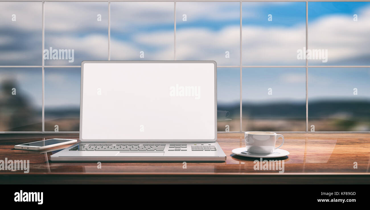 Laptop with white screen placed on a wooden desk. Room with a window ...