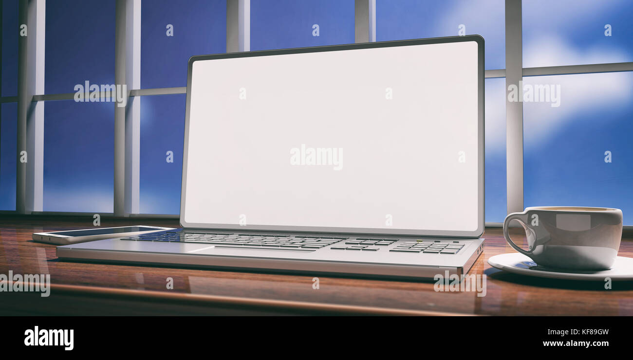 Laptop with white screen placed on a wooden desk. Room with a window ...