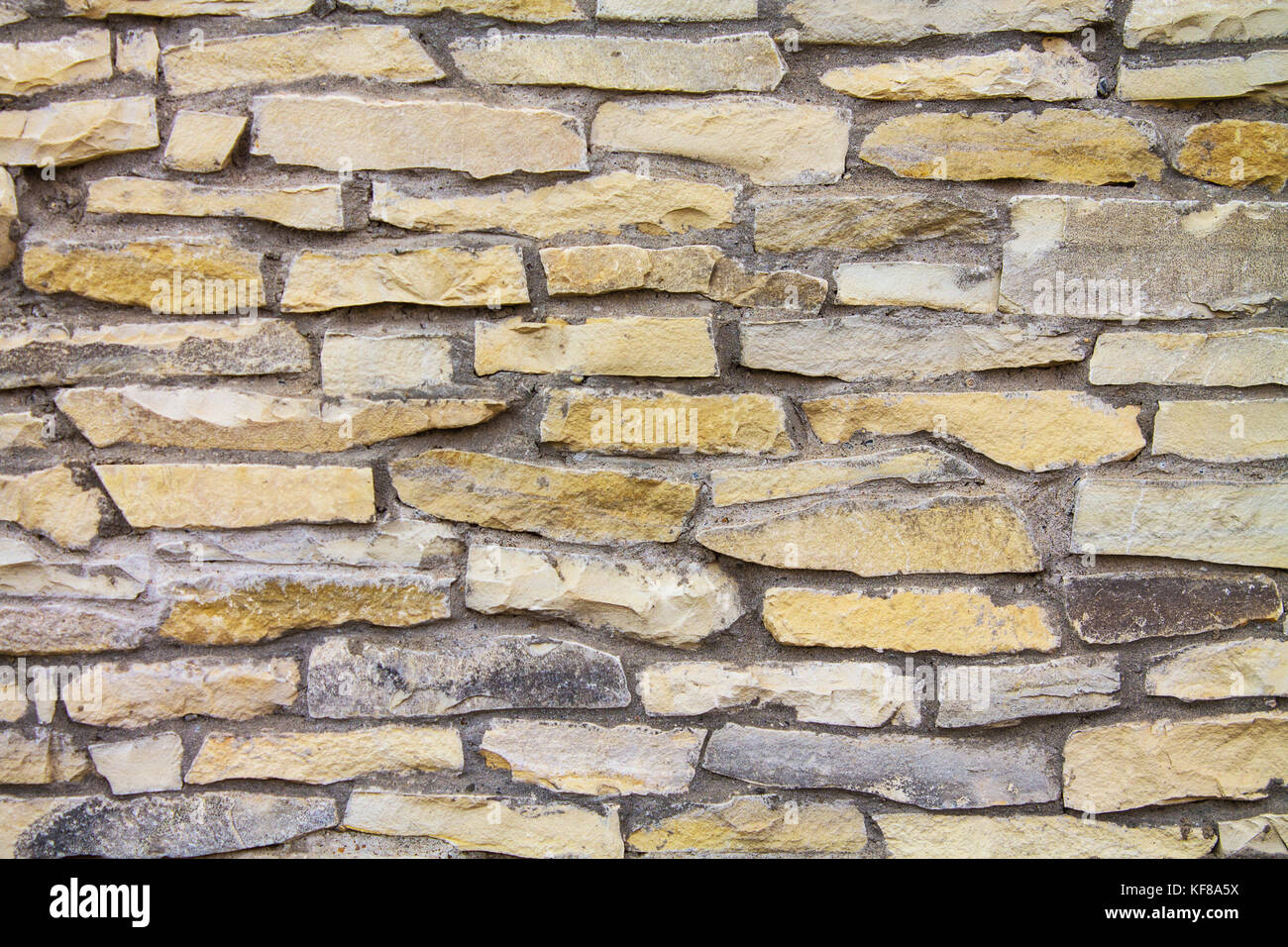 Decorative handmade stone wall for the background Stock Photo - Alamy
