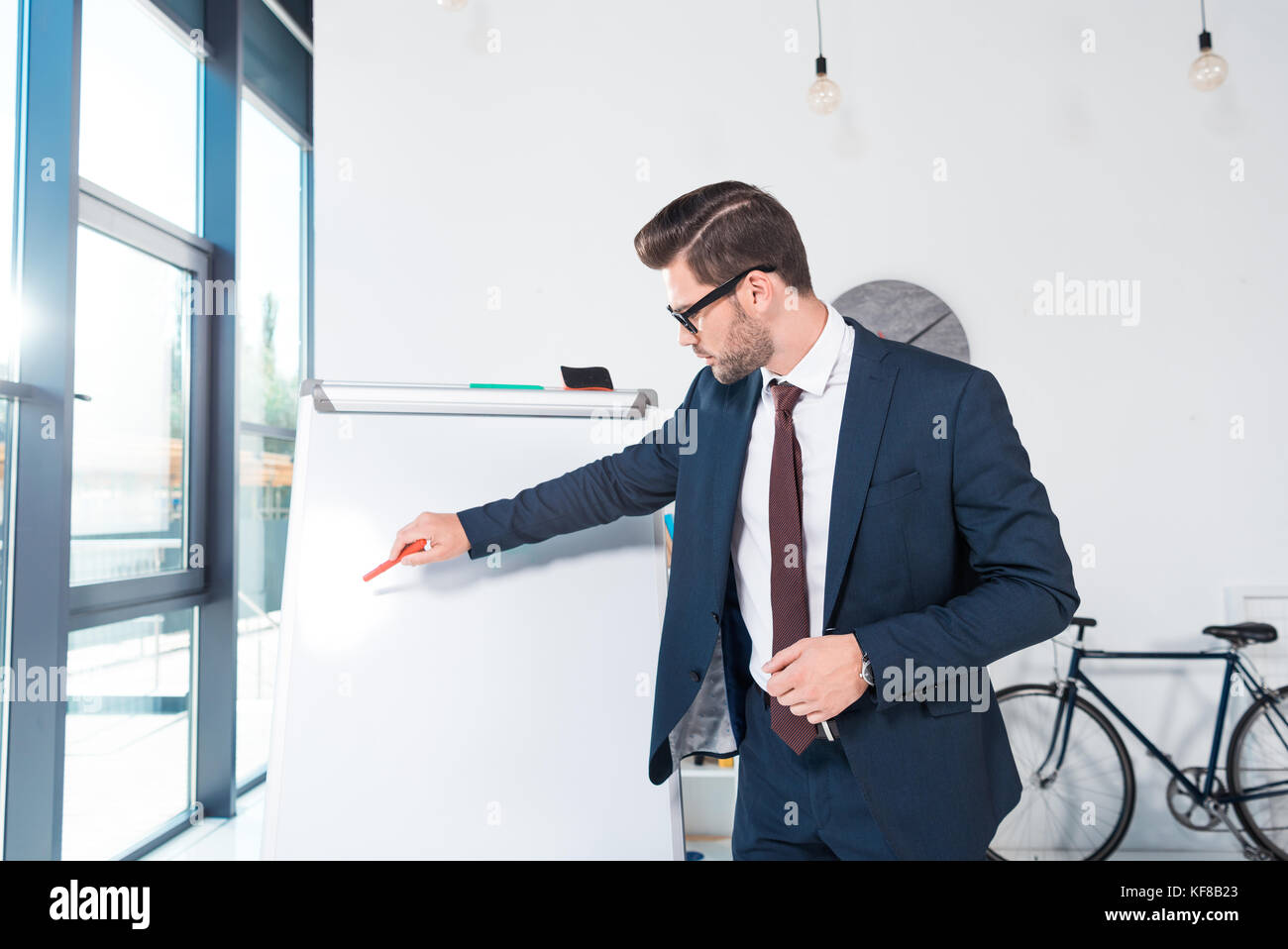 businessman pointing at whiteboard Stock Photo - Alamy