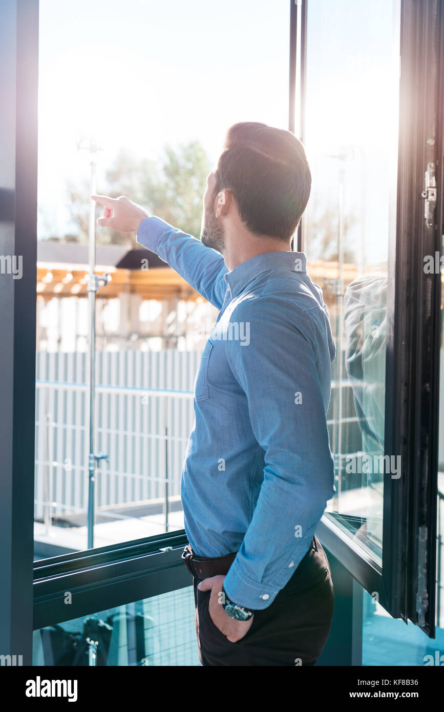 businessman pointing at window Stock Photo - Alamy