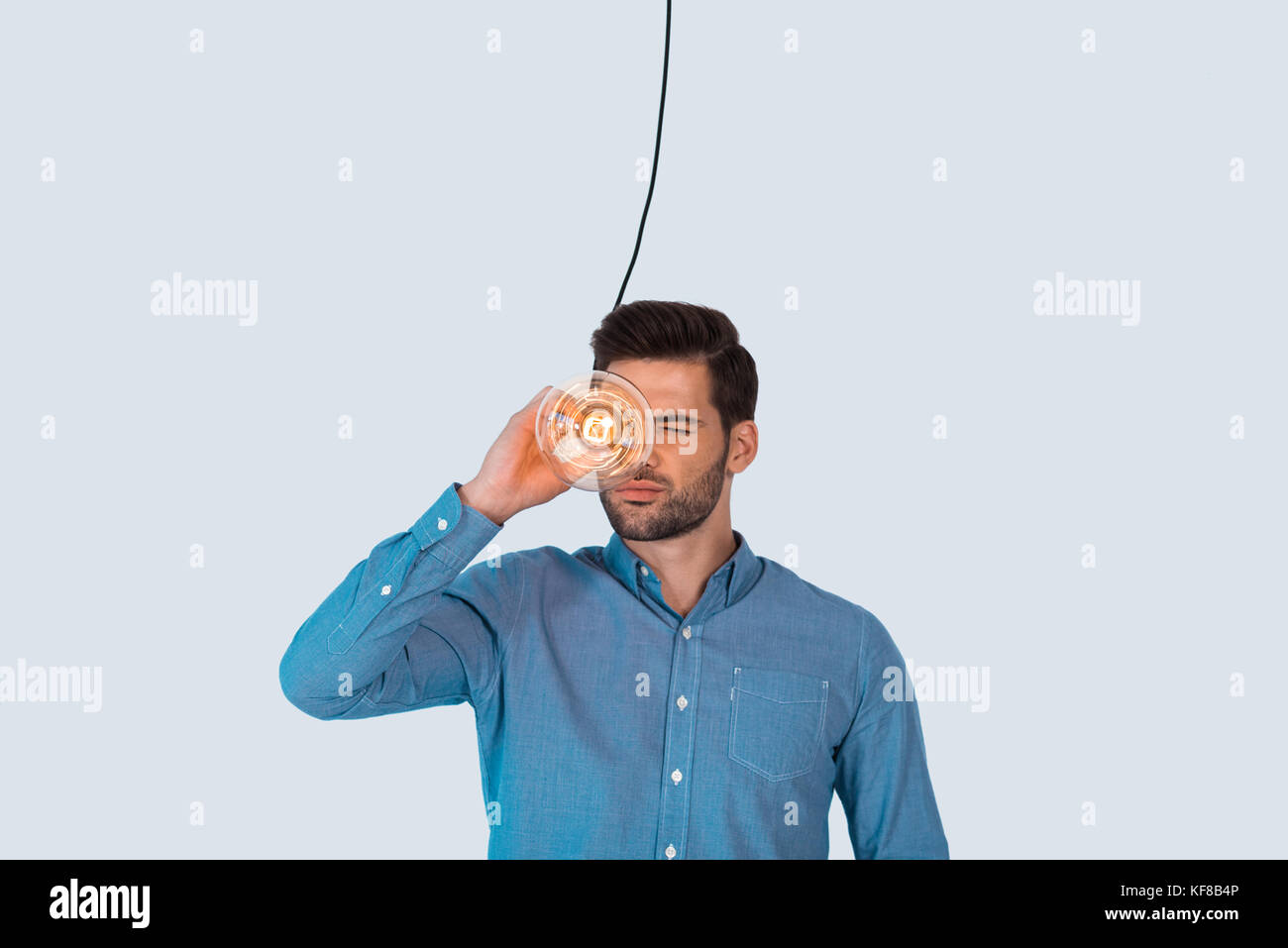 Businessman hold light bulb hi-res stock photography and images - Alamy