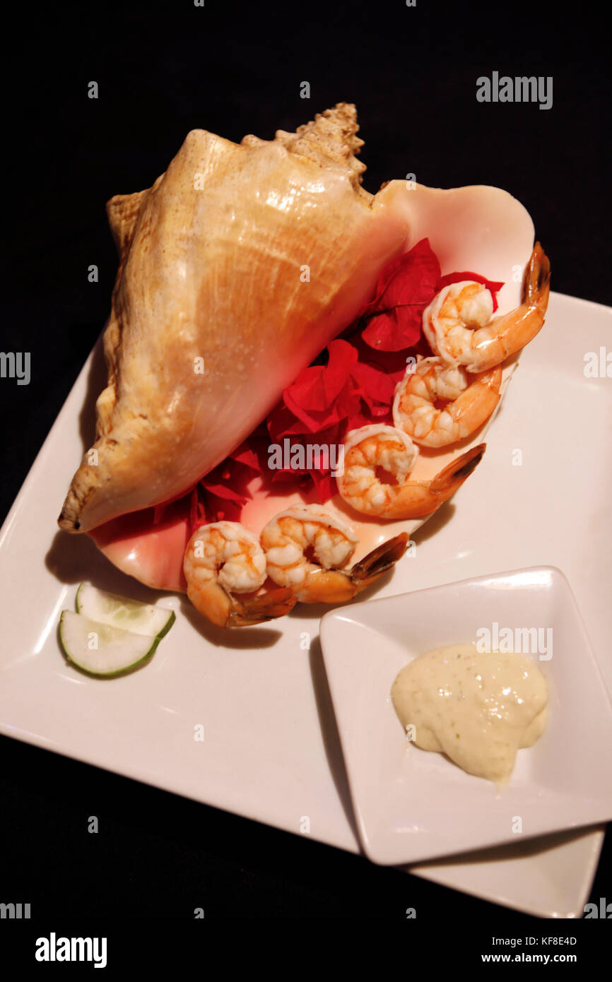 BELIZE, Hopkins, a shrimp appetizer displayed in a conch shell at Love ...