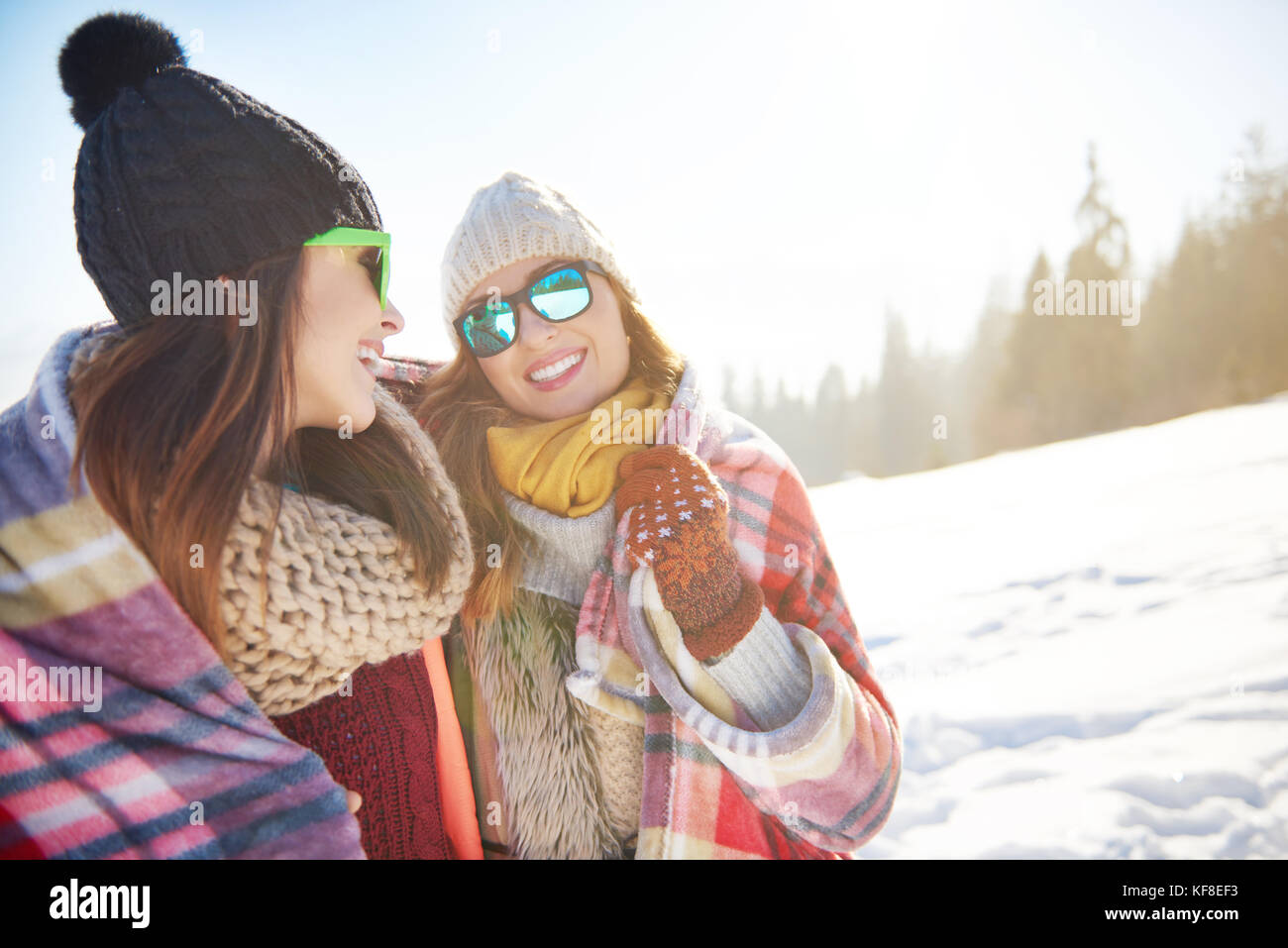 Two friends under the blanket Stock Photo - Alamy