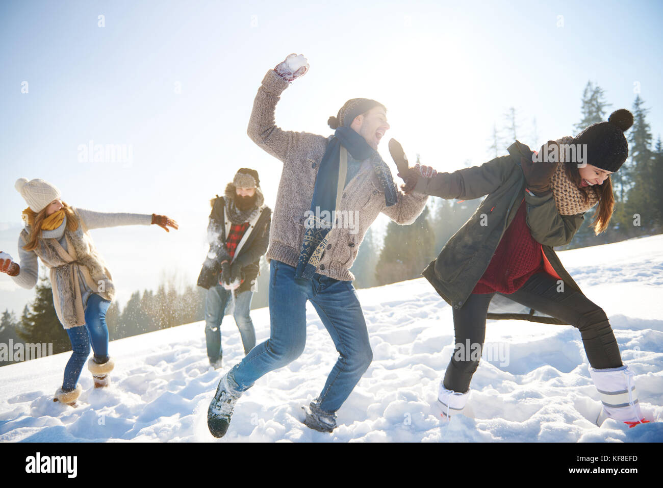 Snowfight on the sunny day Stock Photo - Alamy