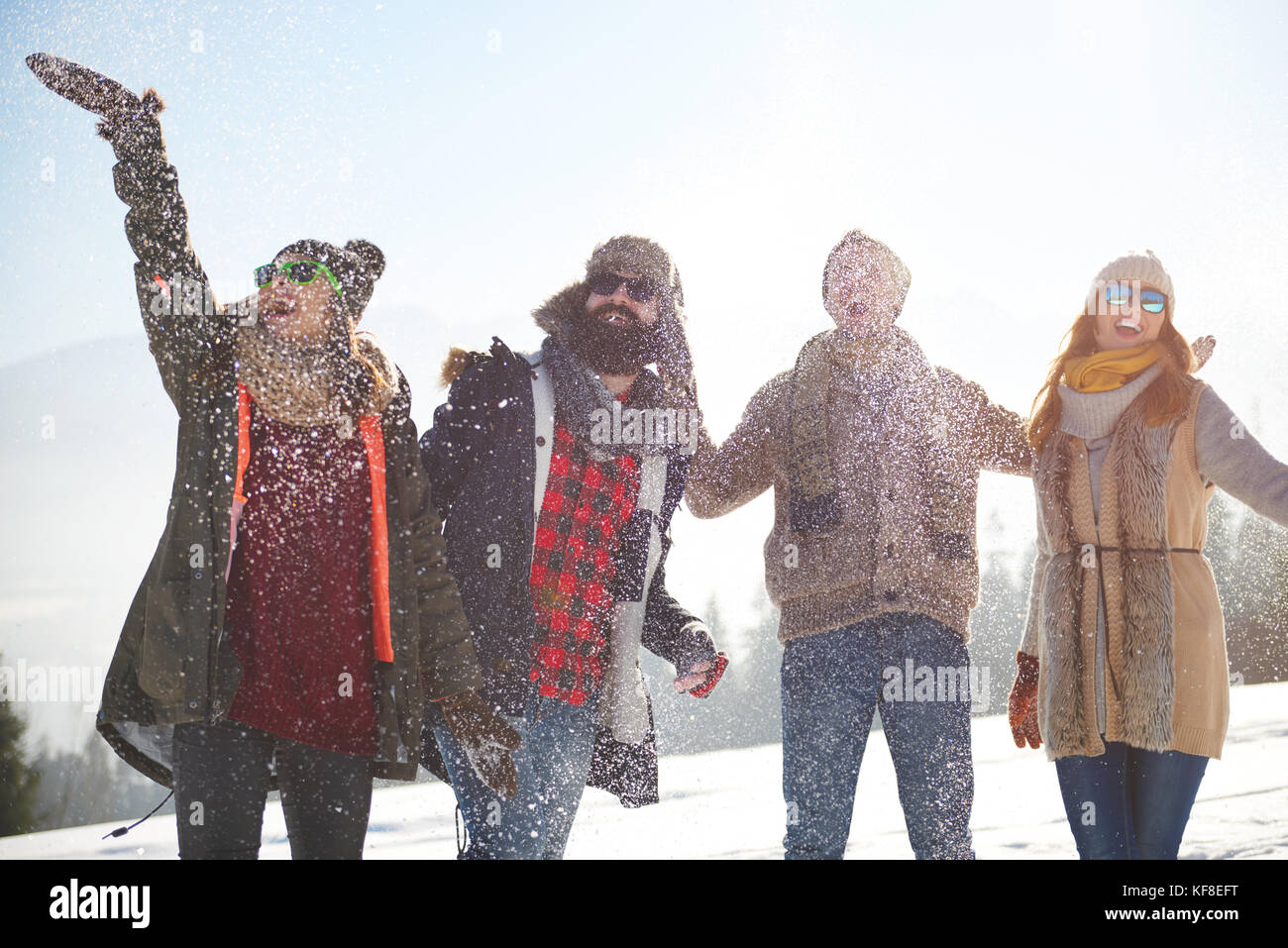 Snow falling on the friends Stock Photo - Alamy