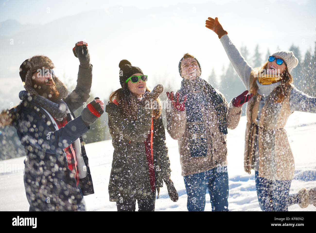 Friends covered with fresh snow Stock Photo - Alamy