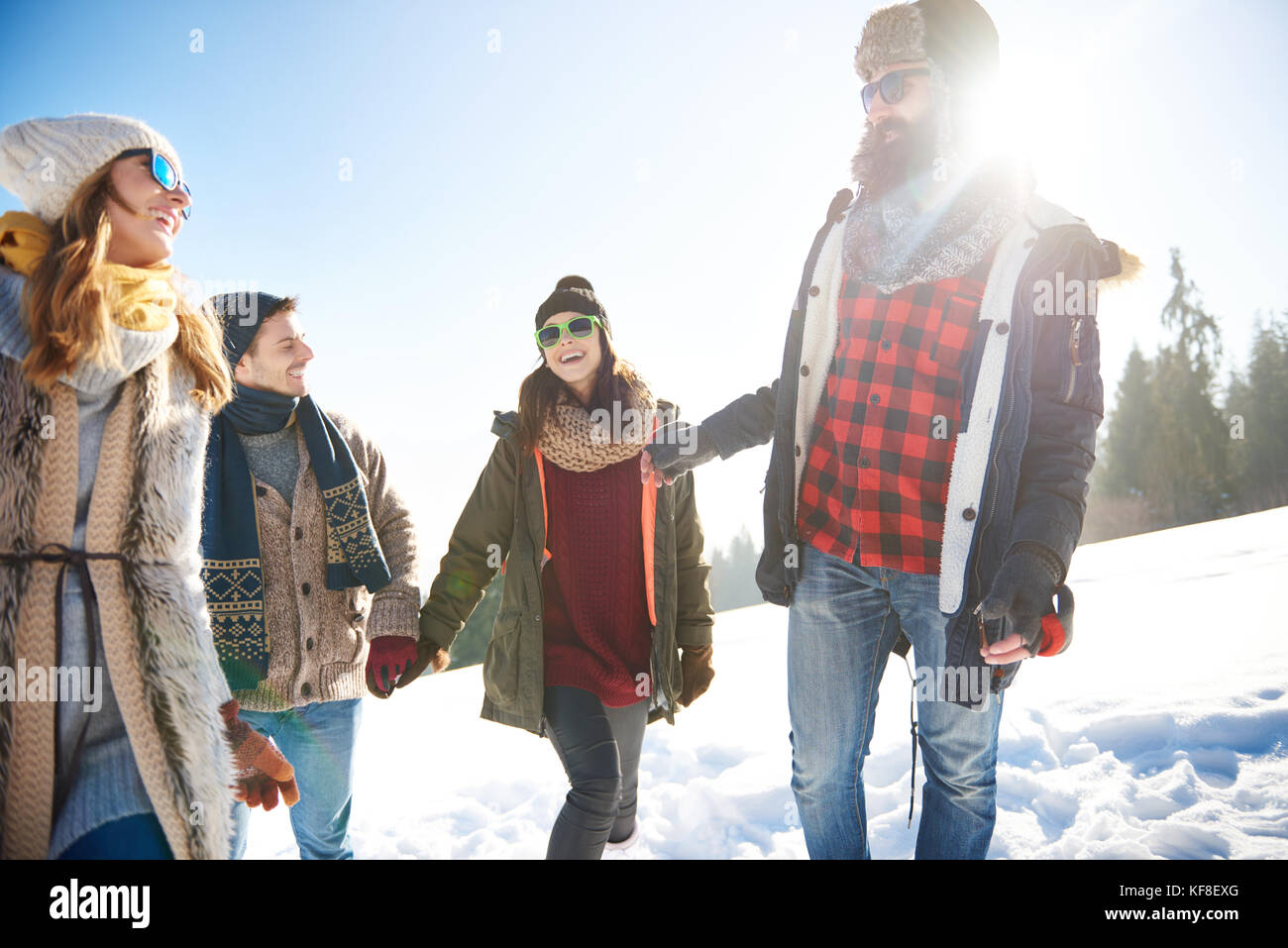 Happy couple having fun over winter background Stock Photo - Alamy