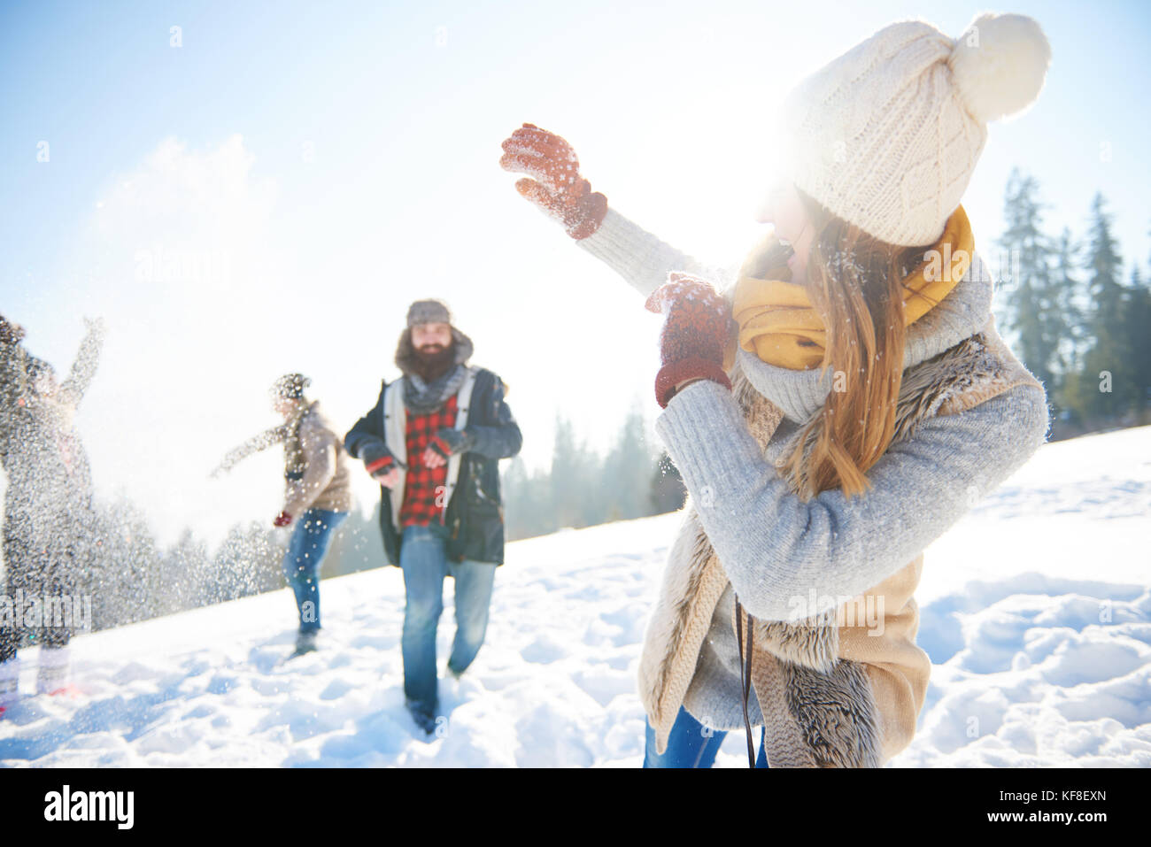 Winter fun young woman throwing hi-res stock photography and images - Alamy