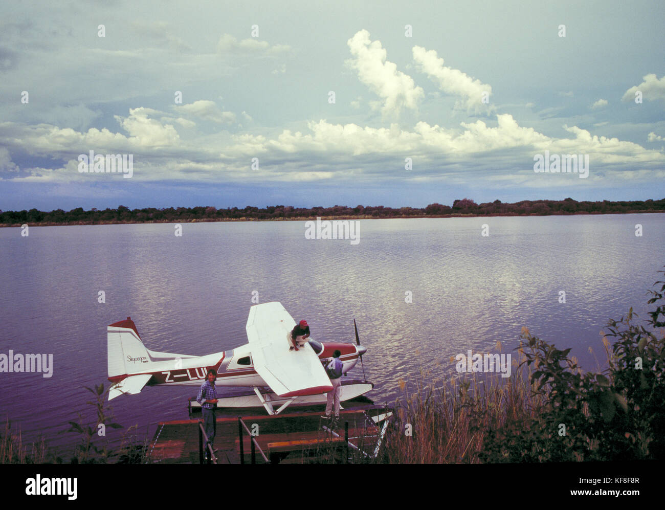 BOTSWANA, Africa, Okavango Delta, A float plane by a dock near Moremi ...