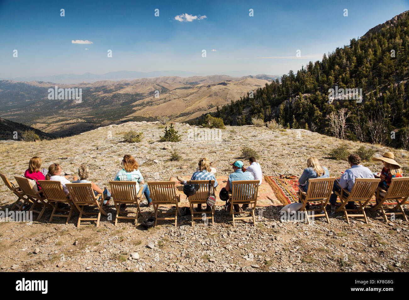 USA, Nevada, Wells, guests take a break and relax during a horse-back ...