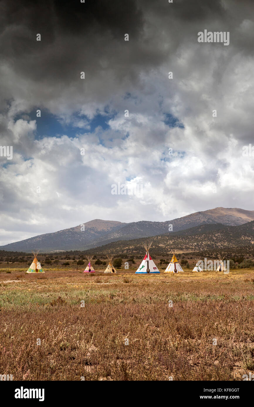 USA, Nevada, Wells, colorful tipis are scattered all over Mustang ...