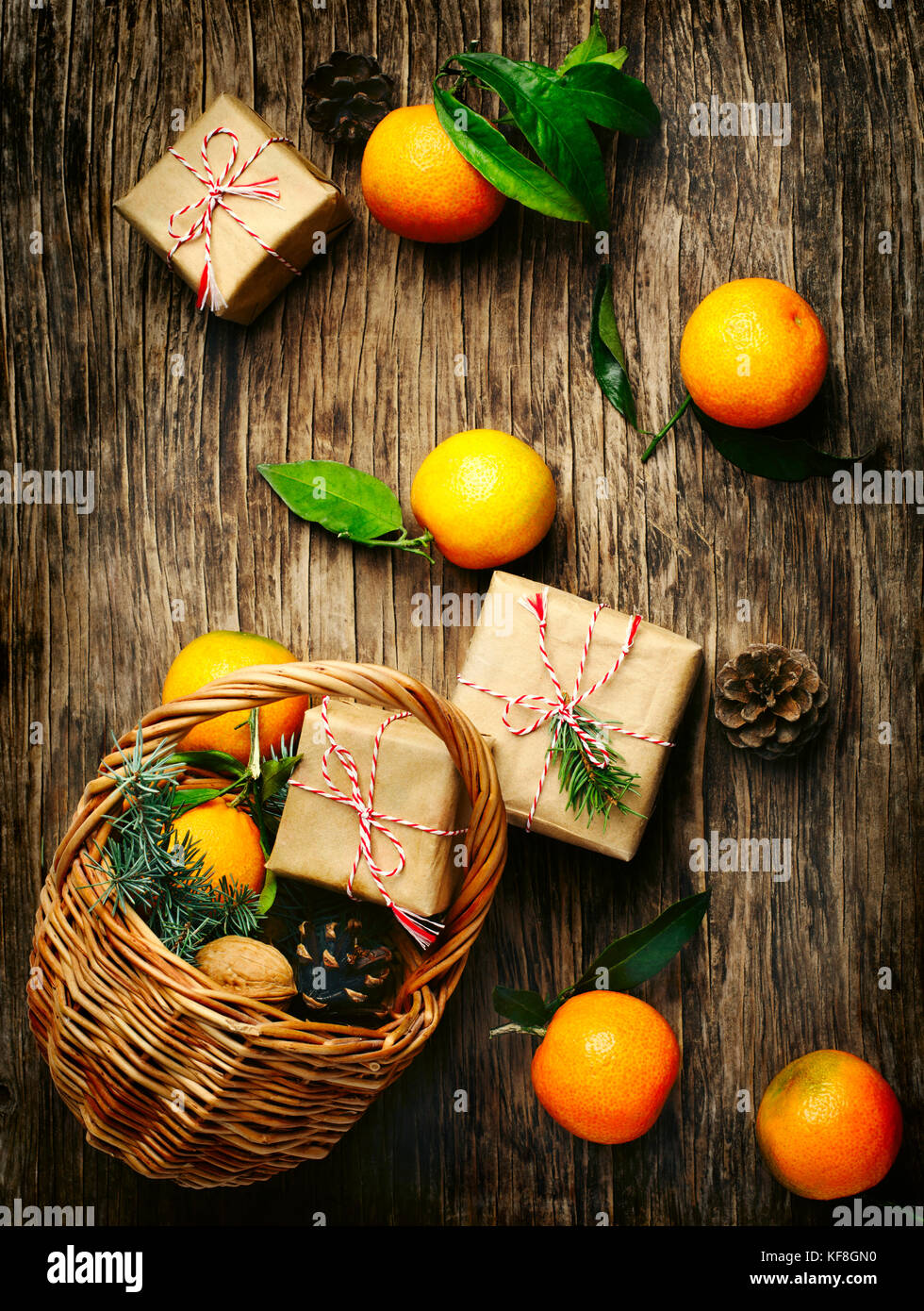 Festive Christmas Basket with gift boxes and tangerines Stock Photo - Alamy