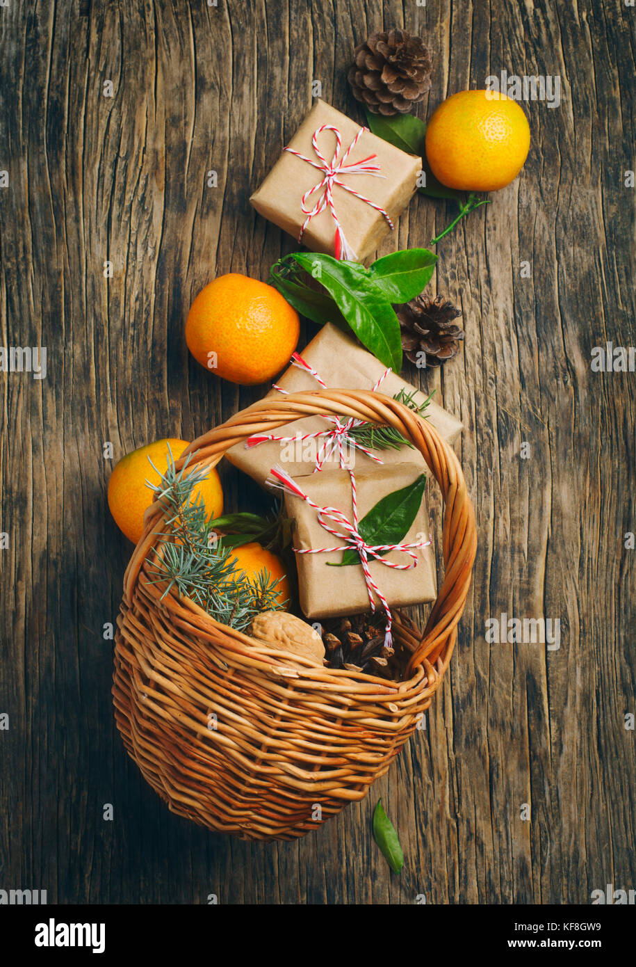 Festive Christmas Basket with gift boxes and tangerines Stock Photo - Alamy