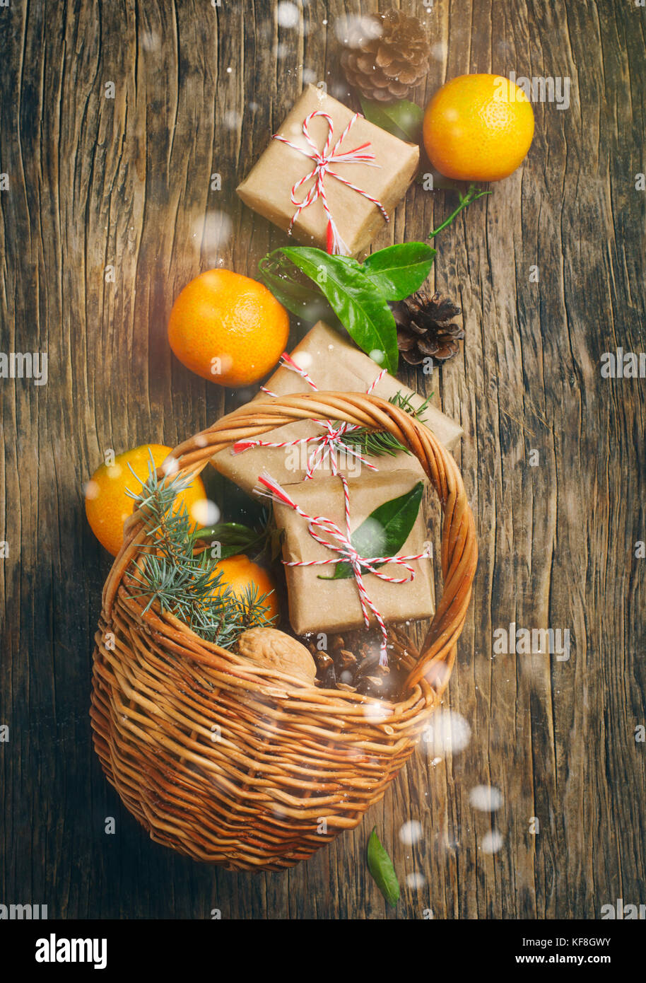 Festive Christmas Basket with gift boxes and tangerines Stock Photo - Alamy