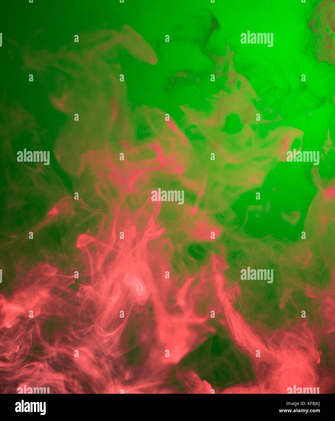 red smoke on green background Stock Photo - Alamy