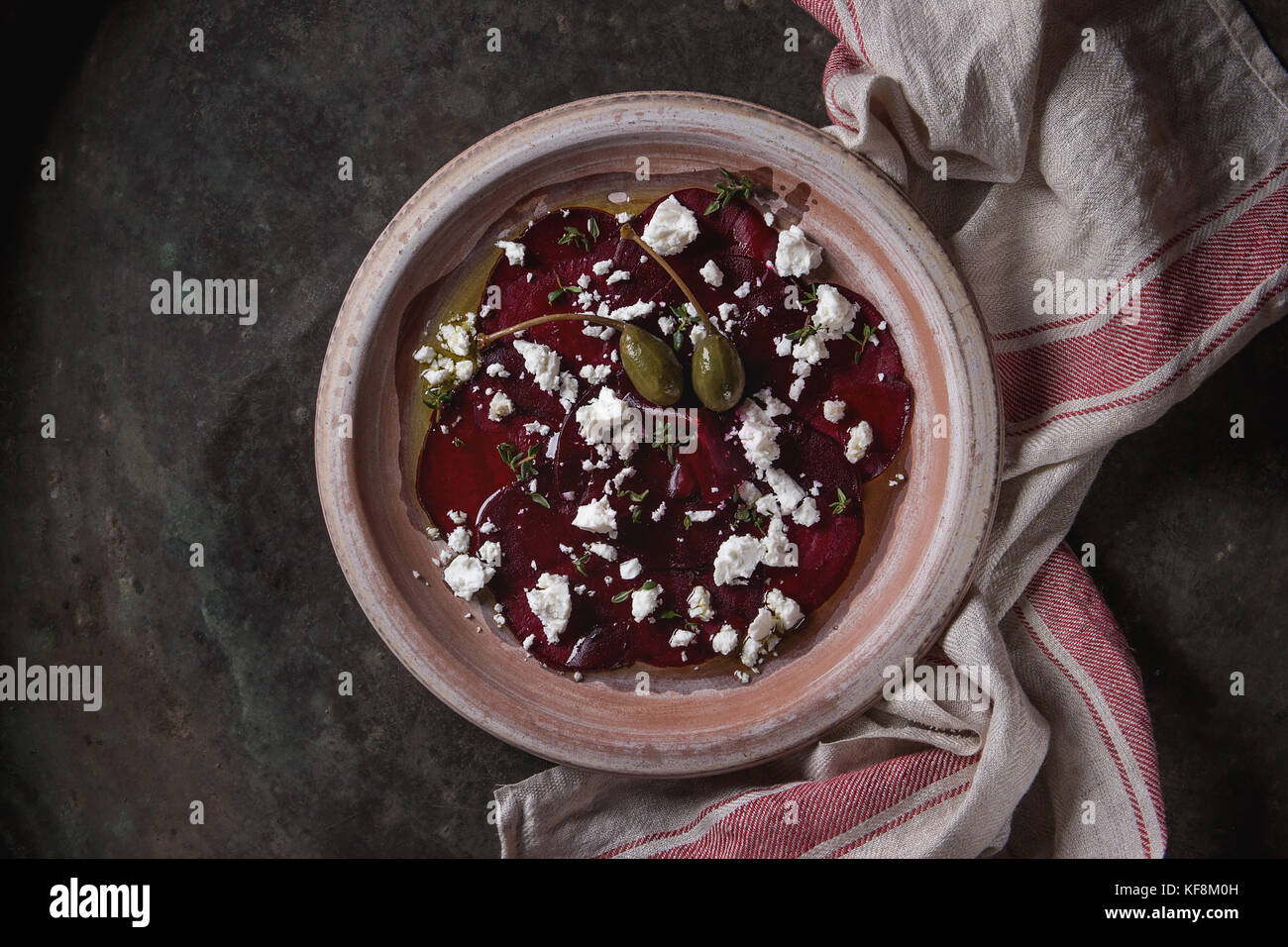 Vegetarian beetroot carpaccio salad with feta cheese, thyme, olive oil ...